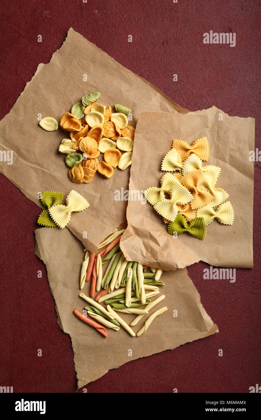 Raw pasta set on paper above, food background Stock Photo - Alamy