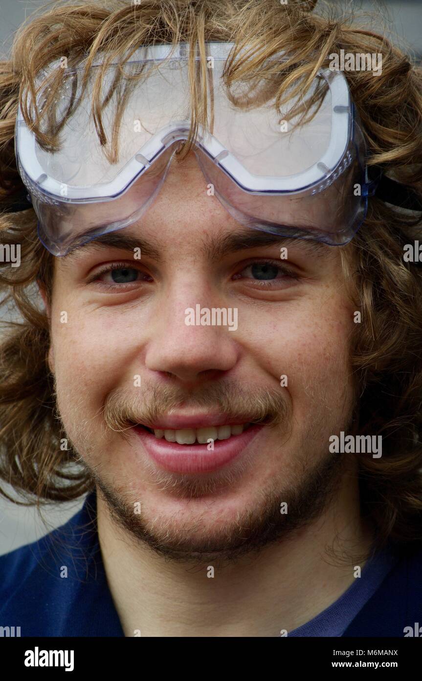 Young Apprentice Workman with Long Hair and Safety Goggles. Exeter ...