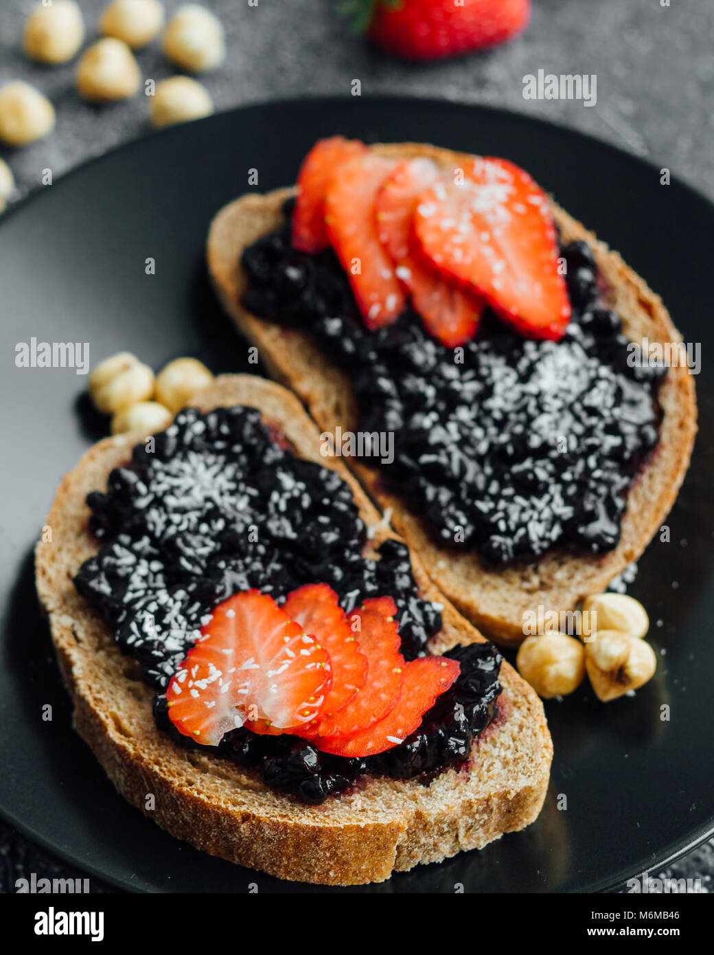blueberry jam on bread with sliced strawberry Stock Photo - Alamy