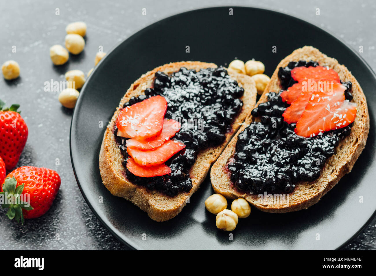 blueberry jam on bread with sliced strawberry Stock Photo - Alamy