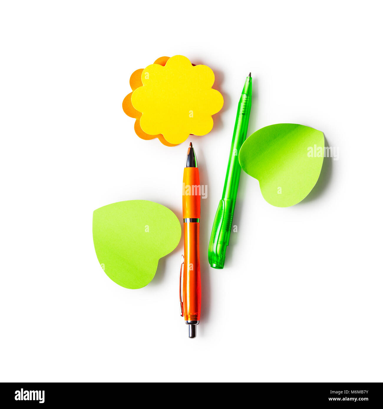 Sticky notes heart and flower shaped with pen isolated on white ...