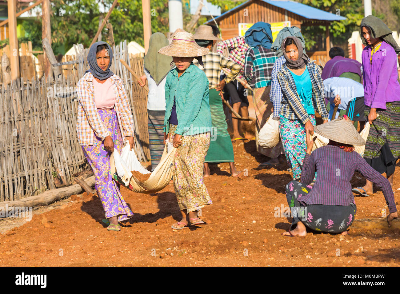 Villagers undertake manual road construction work at West Phwar Saw ...