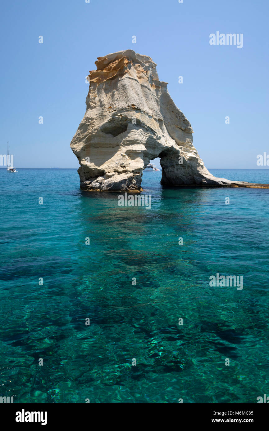 Natural arch rock formation with crystal clear water at Kleftiko ...