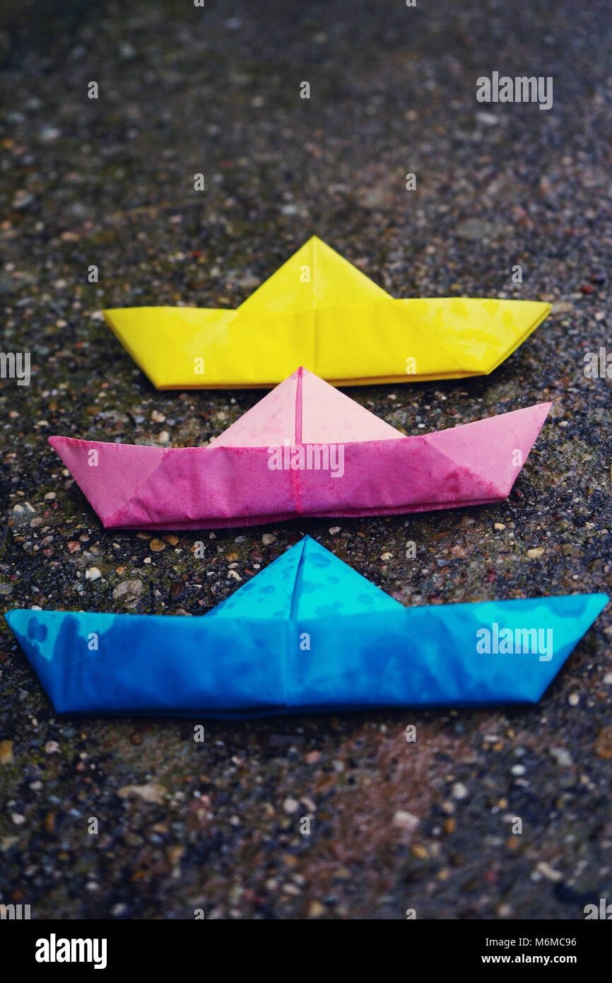 Color paper boats in a rainy day Stock Photo - Alamy