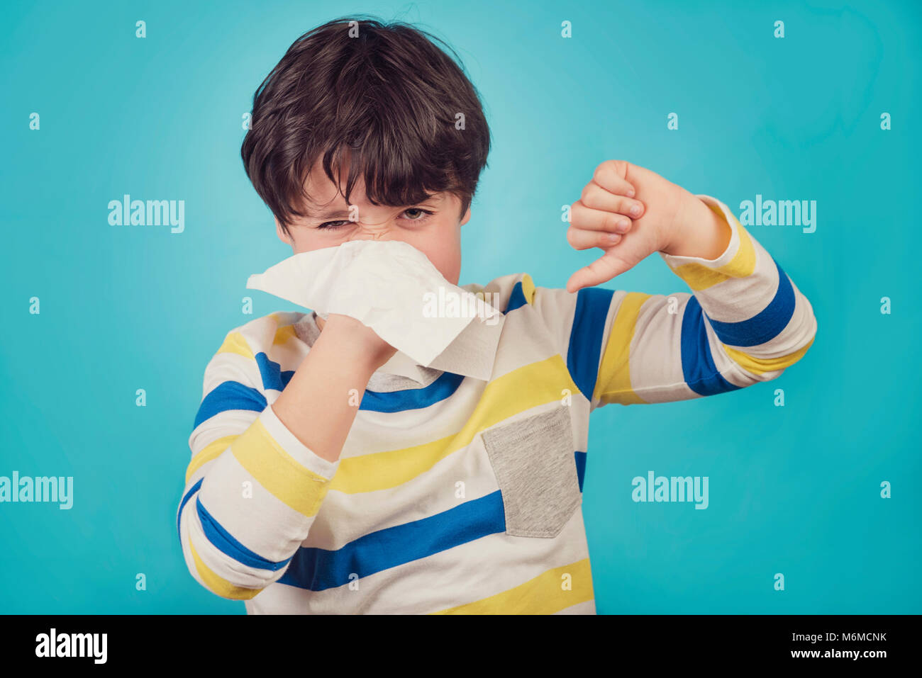 child blowing the nose has a cold child blowing the nose has a cold ...