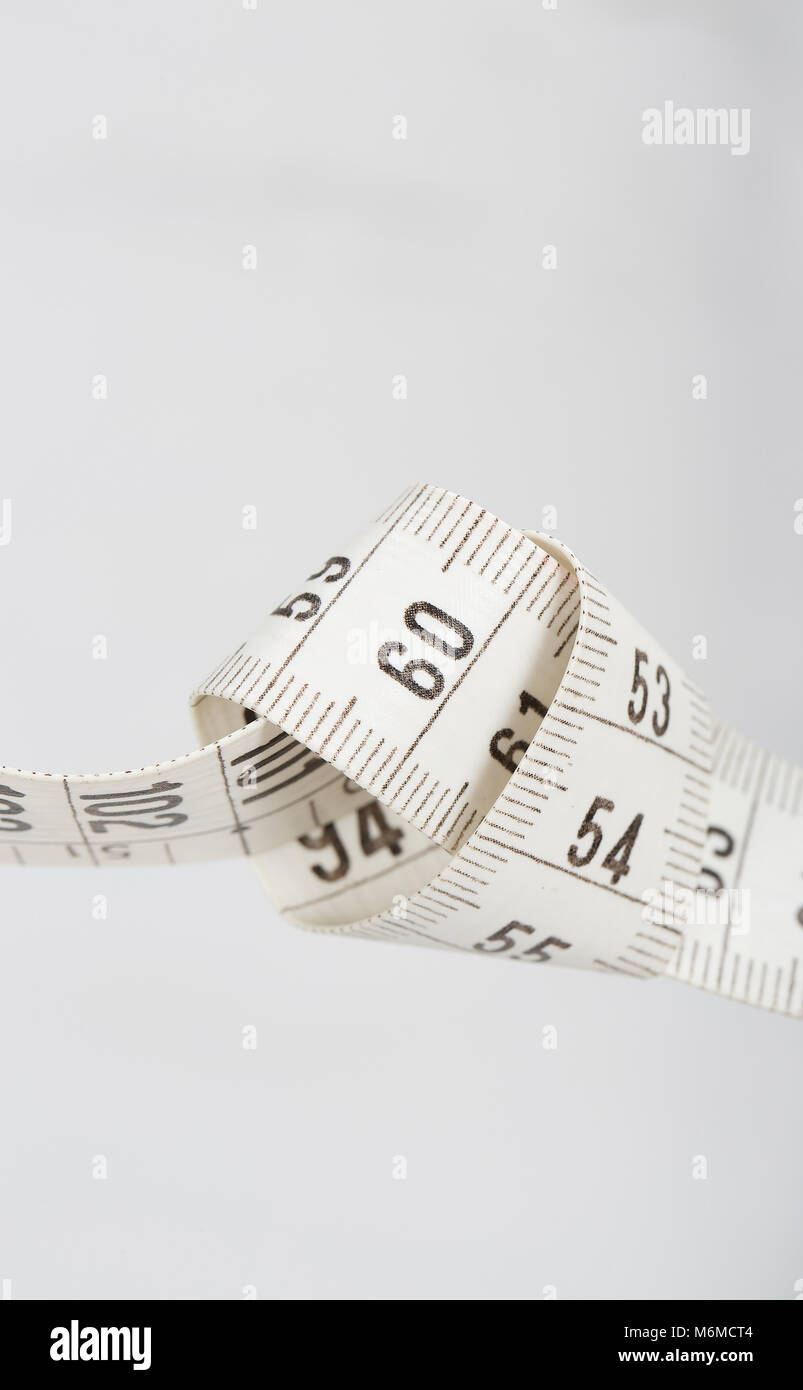 Knot done from measuring band. Closeup Stock Photo - Alamy