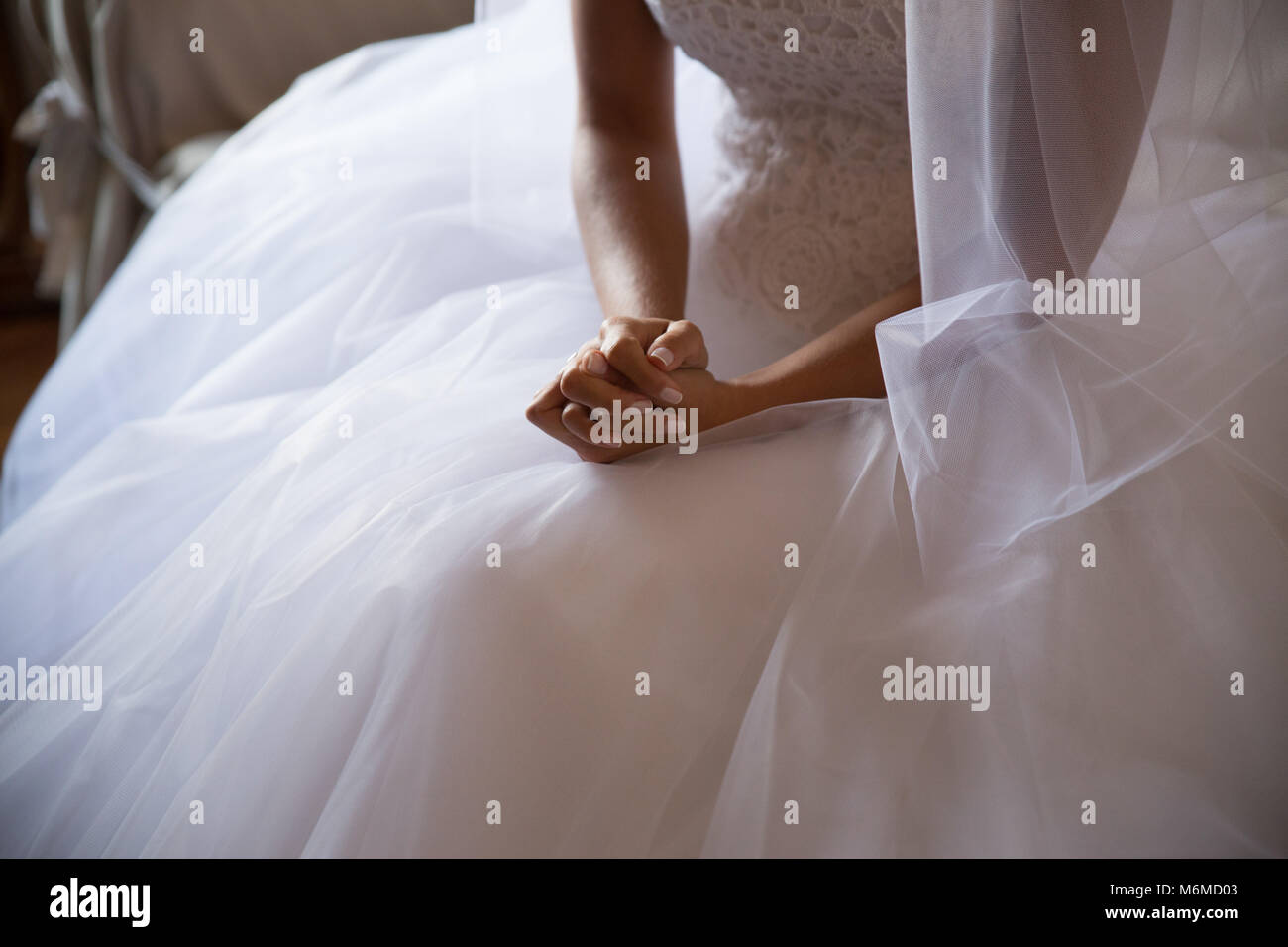 Bride's hands detail with wedding dress Stock Photo - Alamy