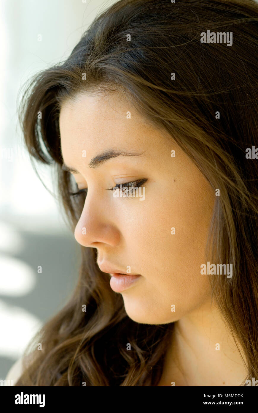 Profile of young beautiful woman Stock Photo - Alamy