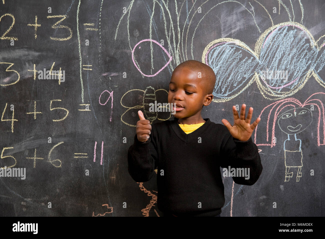 School girl child counting on his hands Stock Photo - Alamy