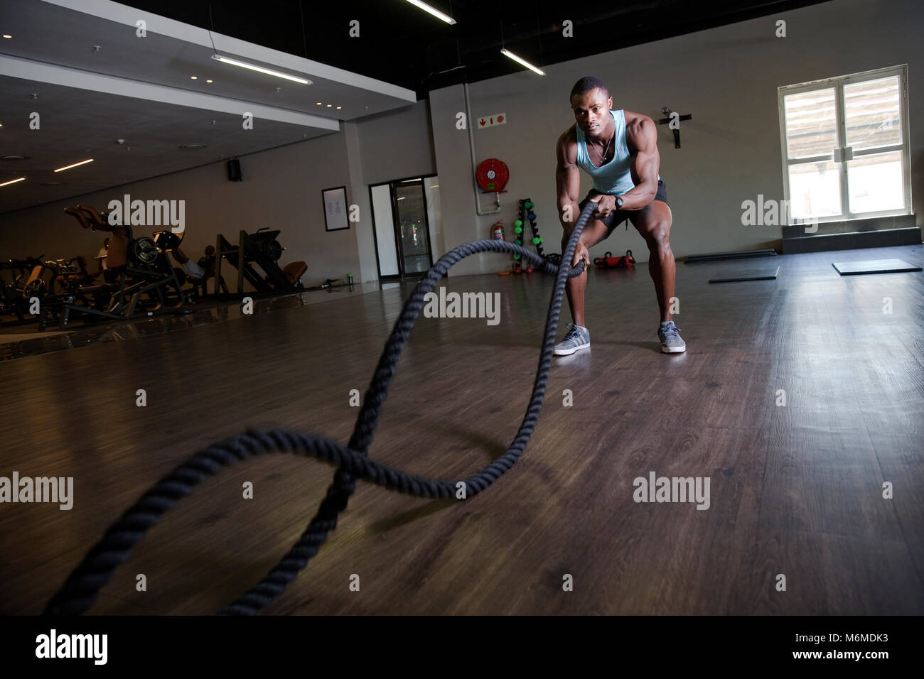 African man working out with heavy ropes Stock Photo - Alamy