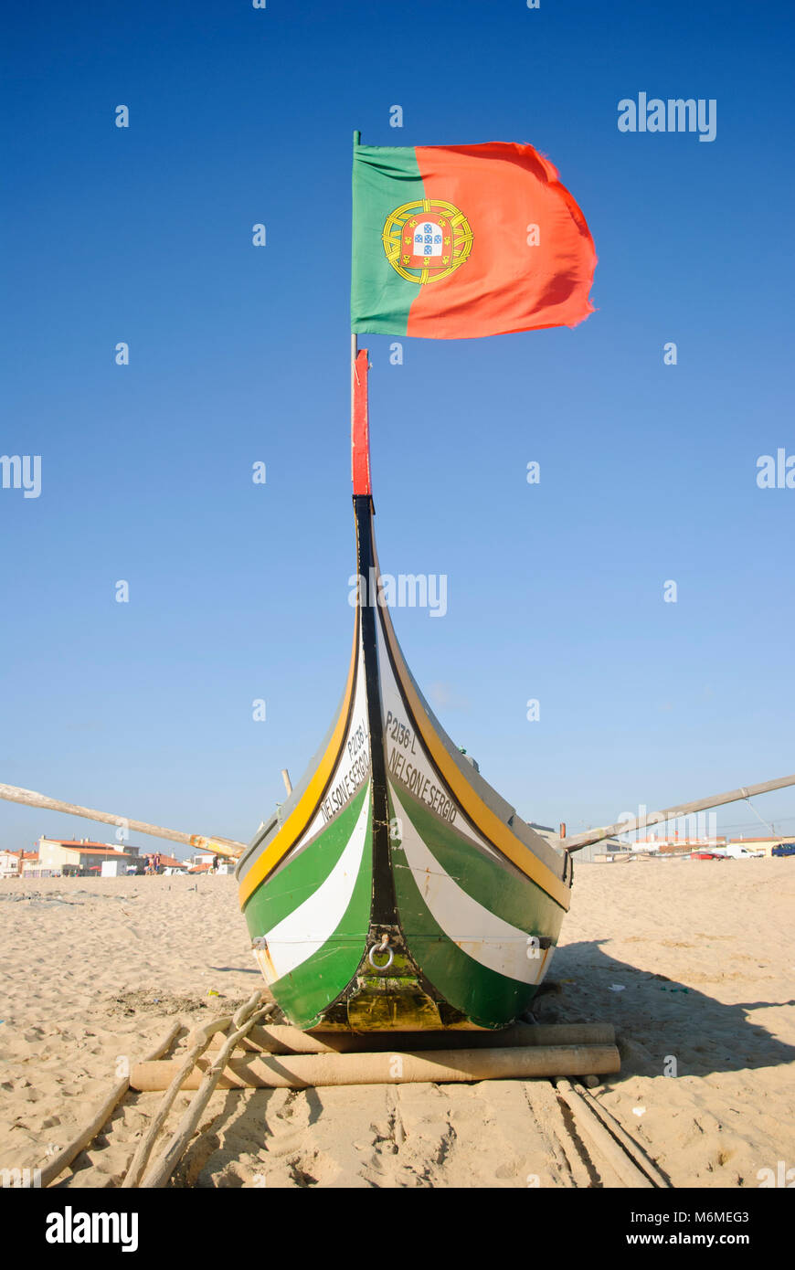 Typical old portuguese fishing boats on the beach of Espinho, Portugal ...