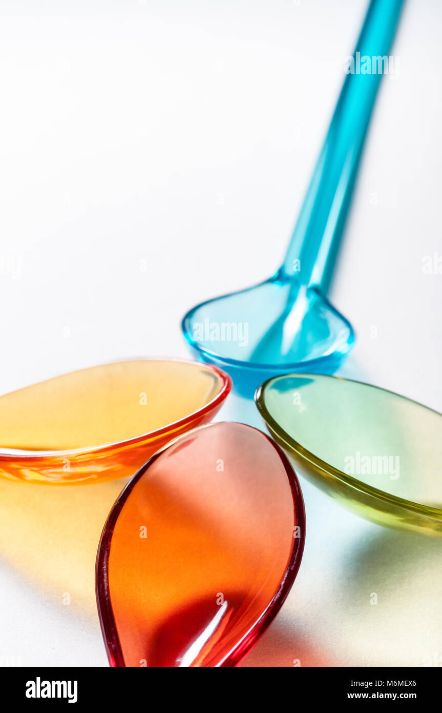 Four bright colourful desert spoons isolated on white background Stock ...