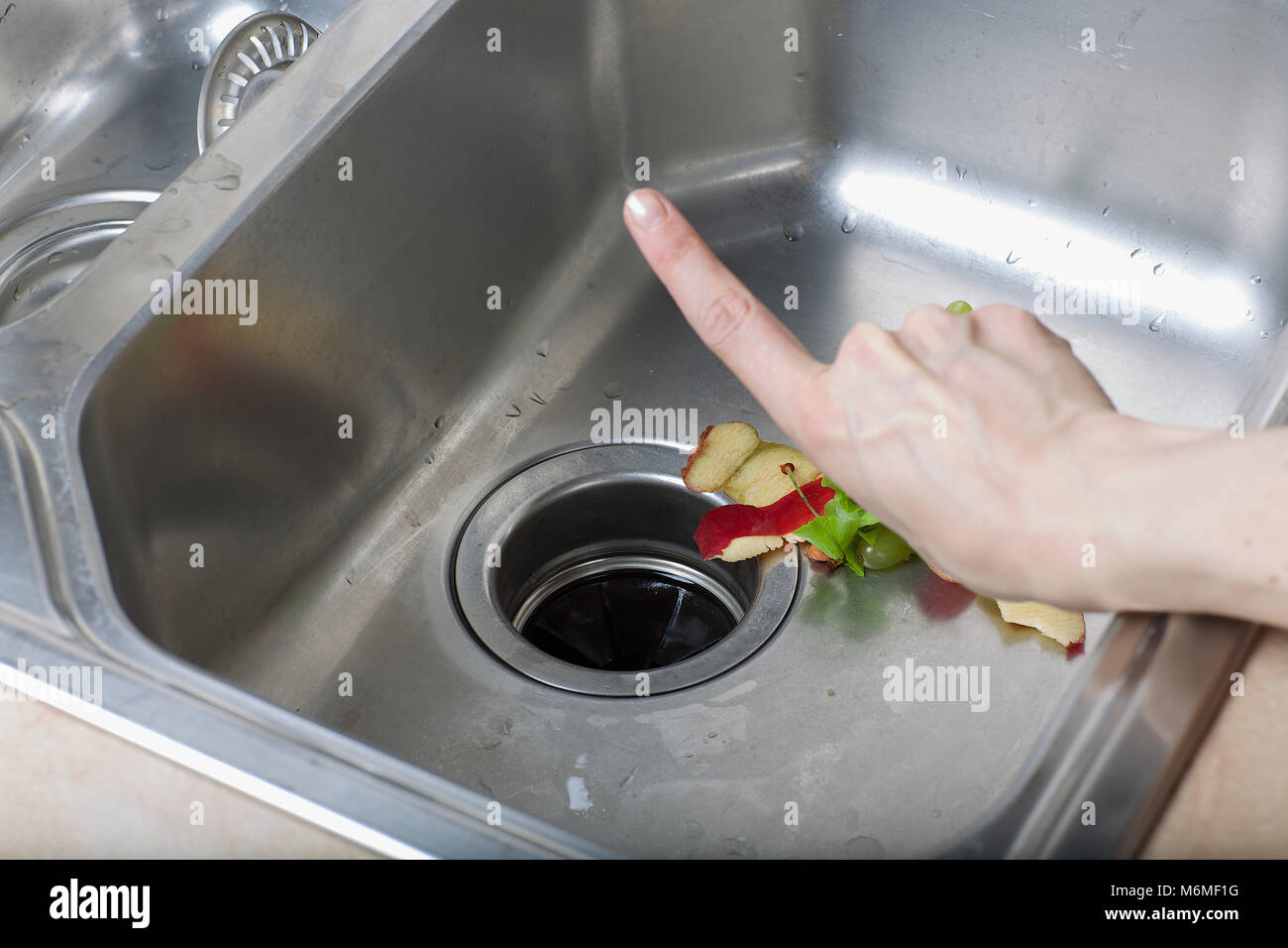 Food waste left in a sink. Closeup Stock Photo - Alamy