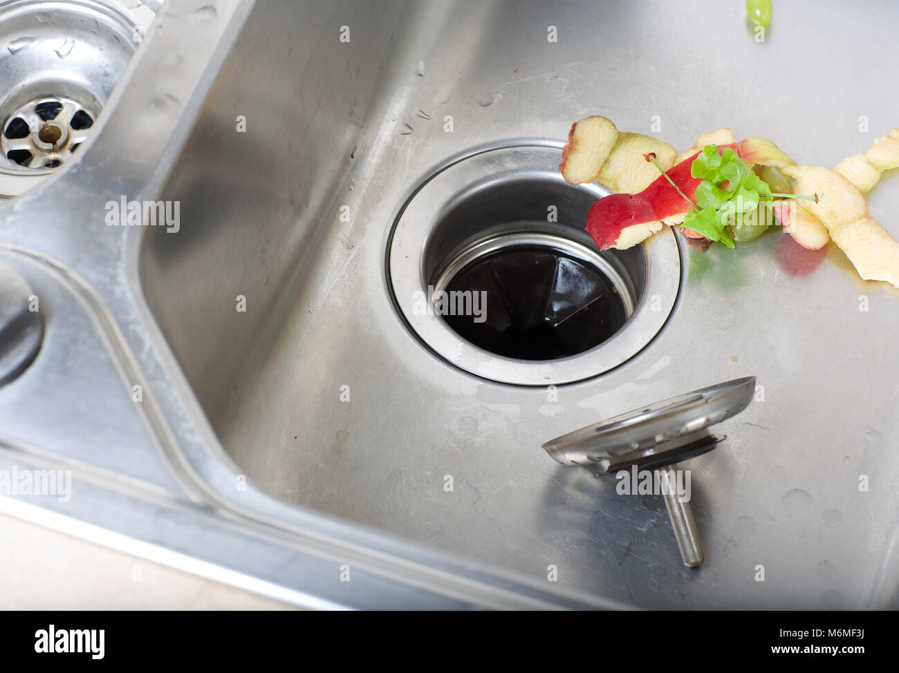 Food waste left in a sink. Closeup Stock Photo - Alamy