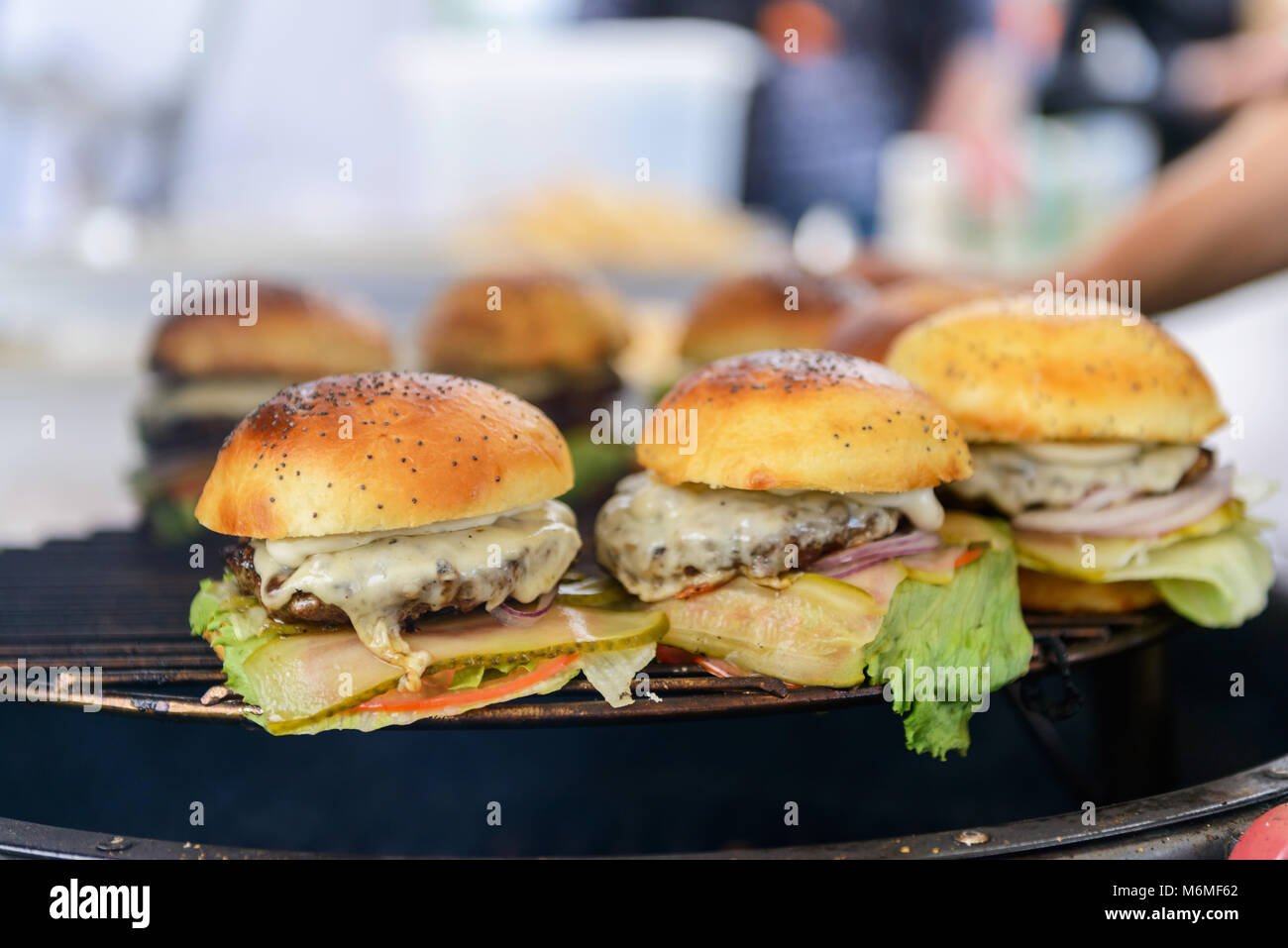 Chef making beef burgers outdoor on open kitchen international food ...