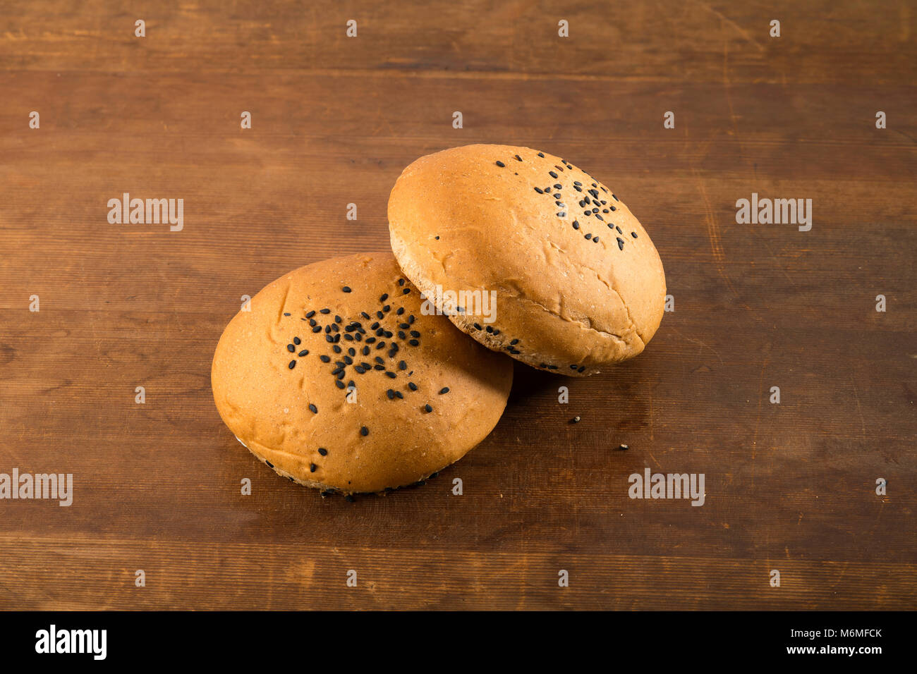 Food:Front View of Whole Wheat Bun Isolated on Wooden Background Stock ...