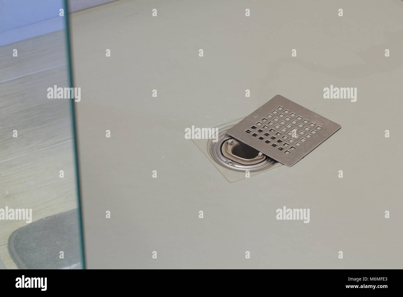 Shower drain box grate on a shower base Stock Photo - Alamy