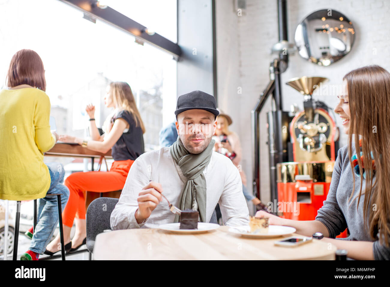 Friends in the cafe Stock Photo - Alamy
