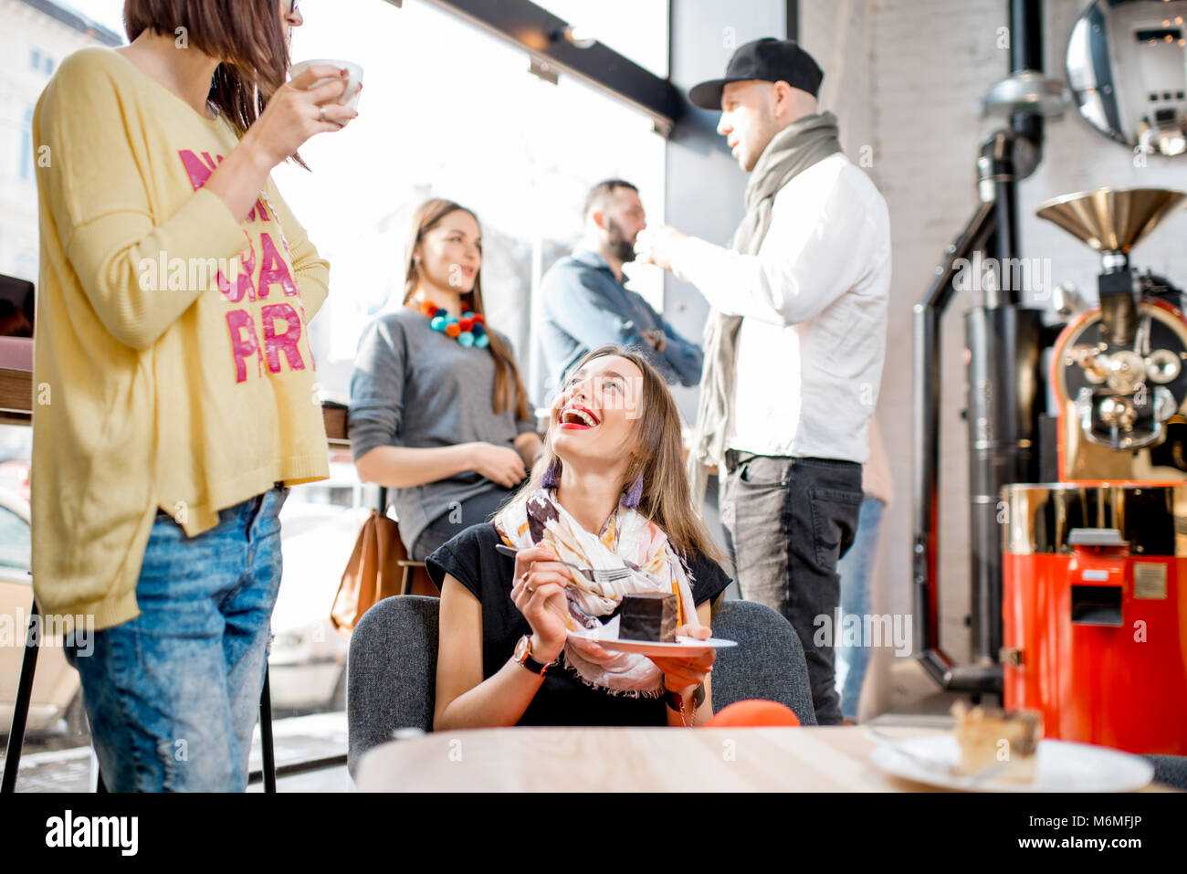 Diverse friends eating cake hi-res stock photography and images - Alamy