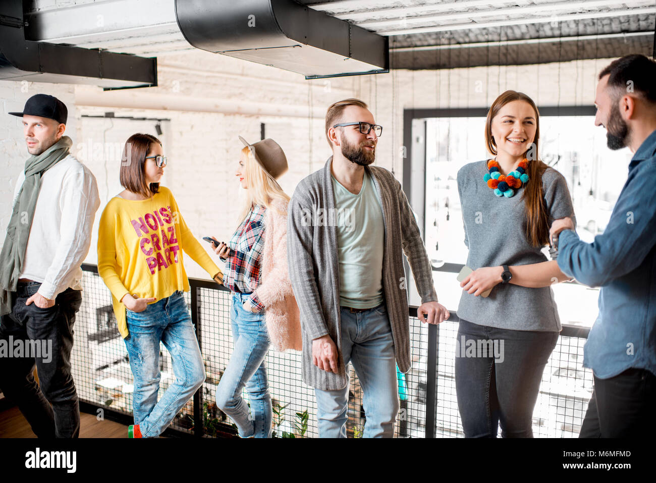 Friends talking during the break in the conference hall Stock Photo - Alamy