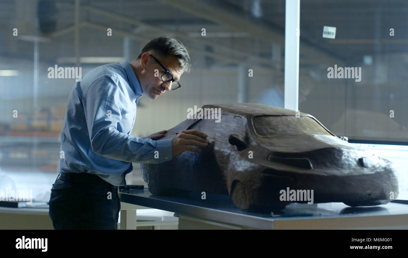 Chief Automotive Designer with Rake Sculpts Futuristic Car Model from ...