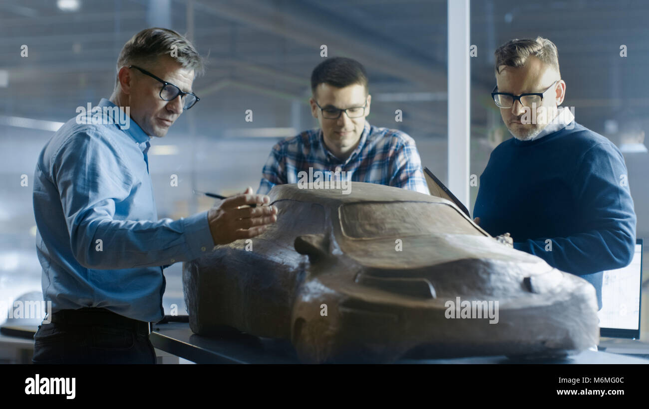 Team of Automotive Design Engineers Discusses New Prototype Model Made ...