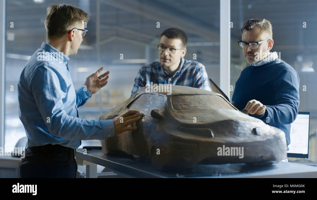 Team of Automotive Design Engineers Discusses New Prototype Model Made ...