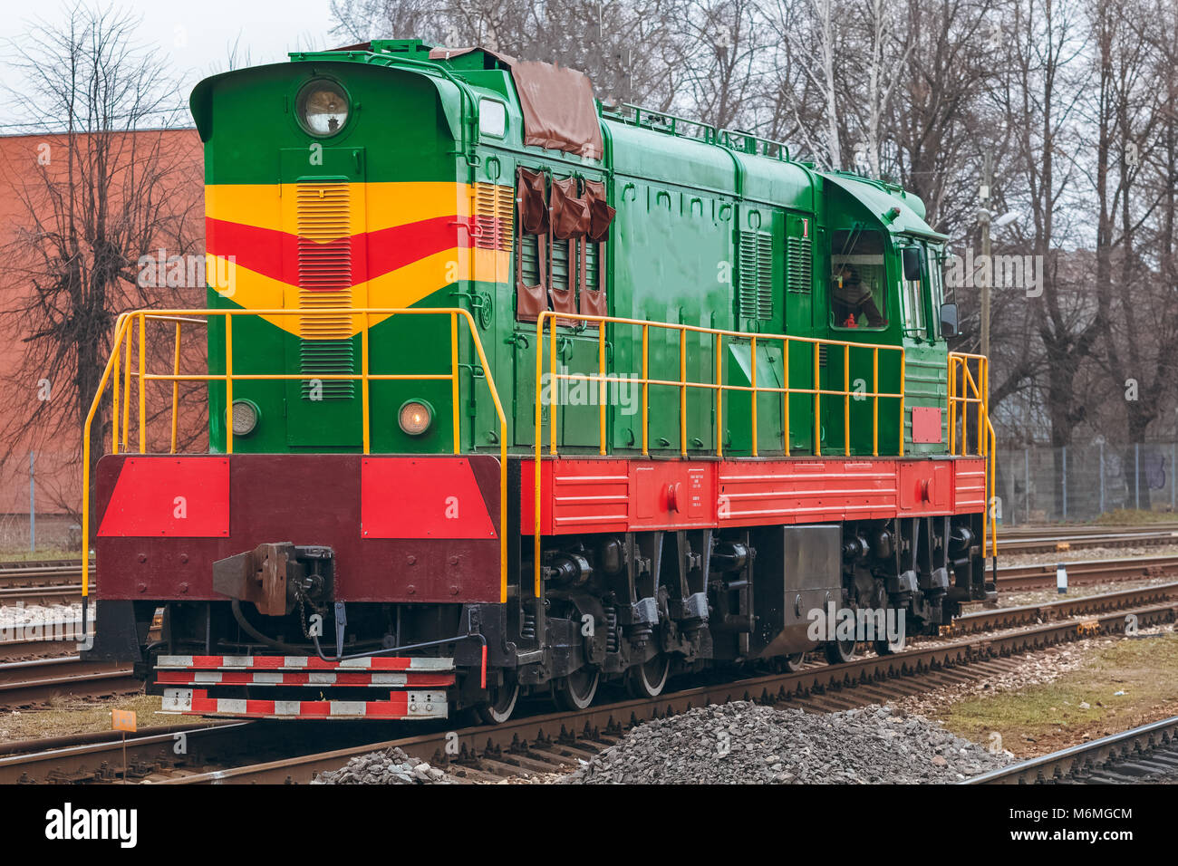 Green diesel cargo locomotive. Freight train in action Stock Photo - Alamy