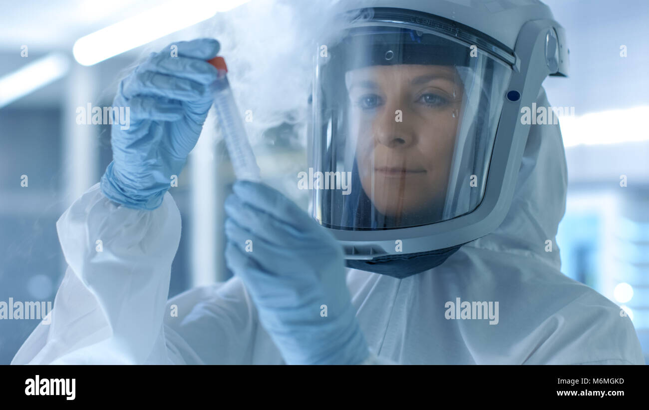 Medical Virology Research Scientist Works in a Hazmat Suit with Mask ...