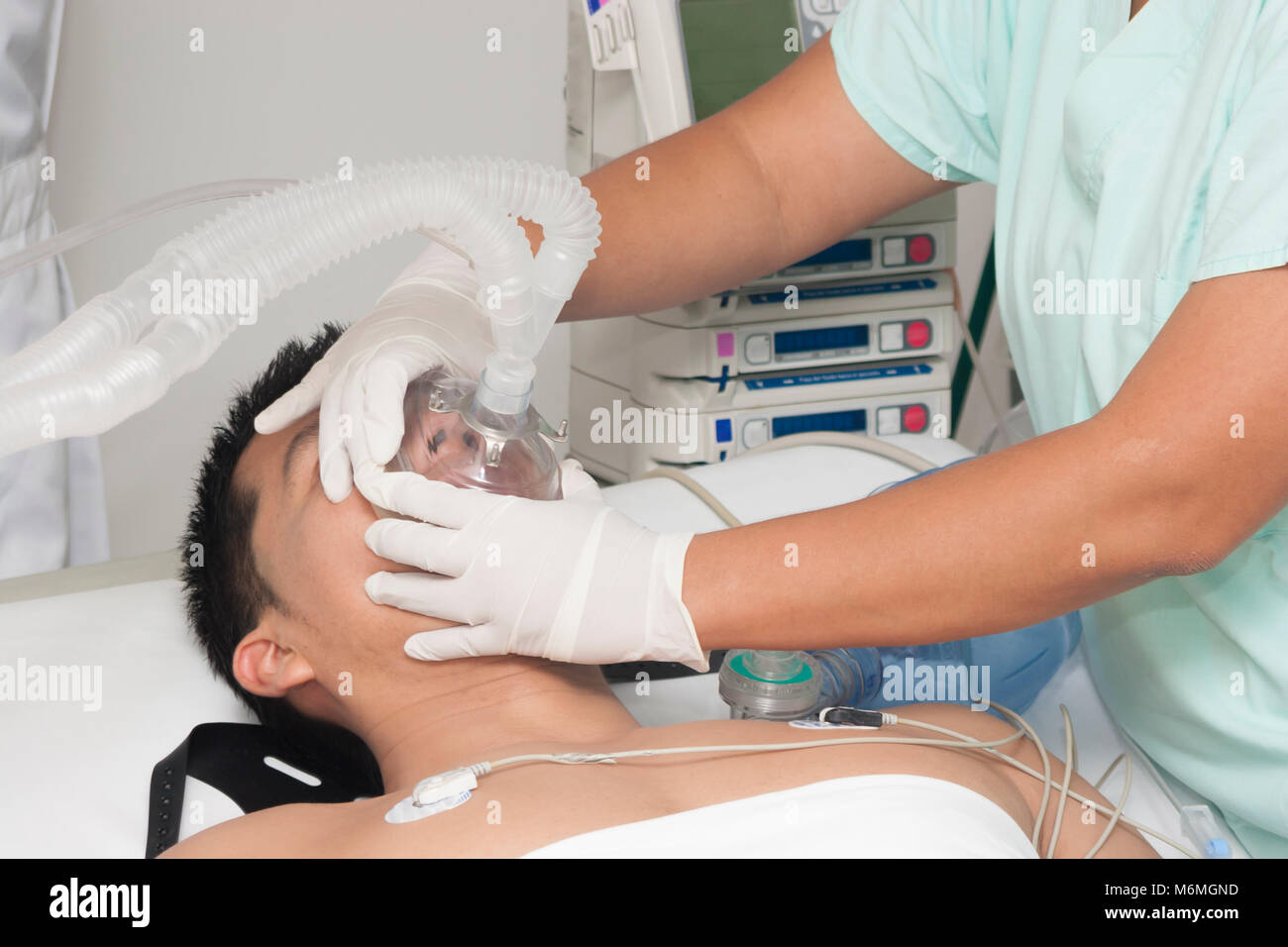 Portrait of patient receives artificial ventilation in hospital Stock ...