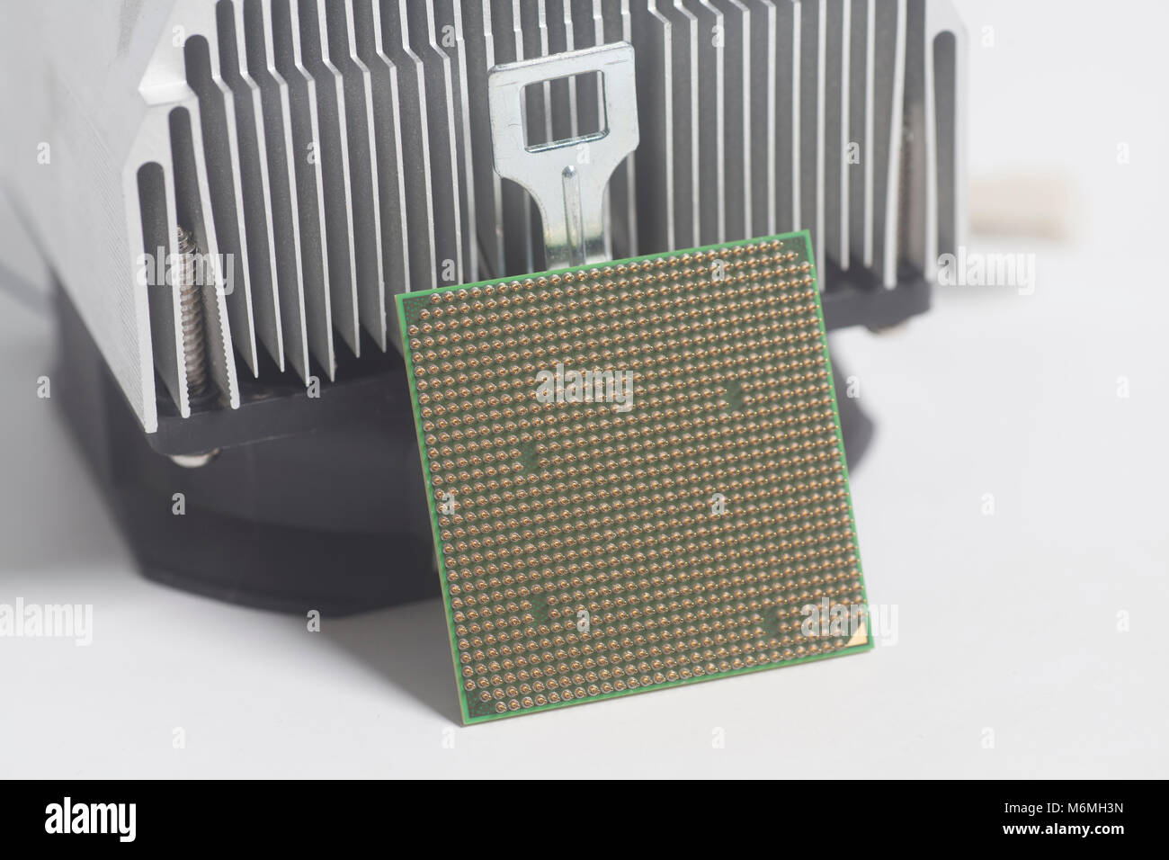Central processing unit CPU microchip with metal cooler on white ...