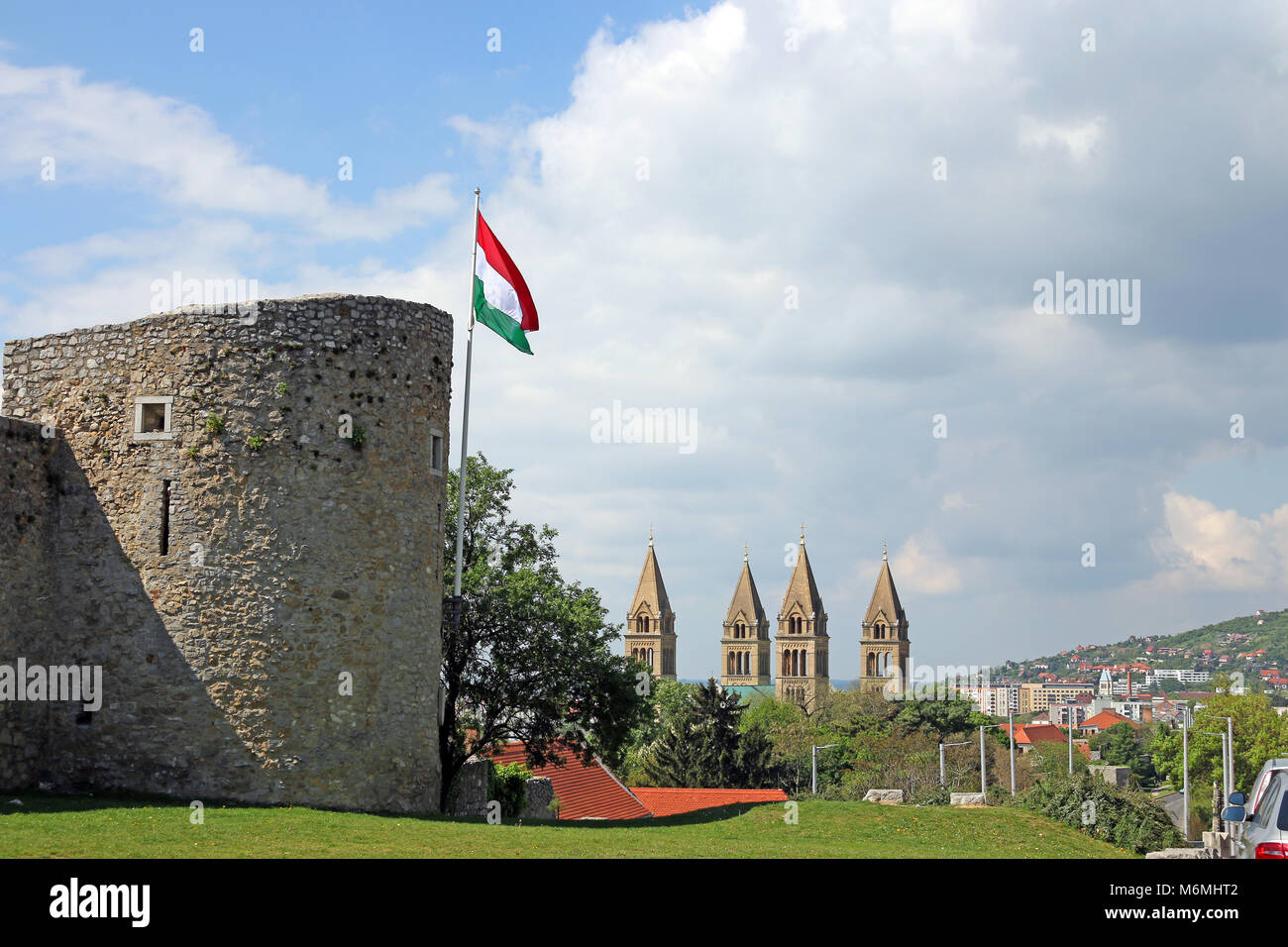 Cathedral and fortress tower with Hungarian flag Pecs Hungary Stock ...
