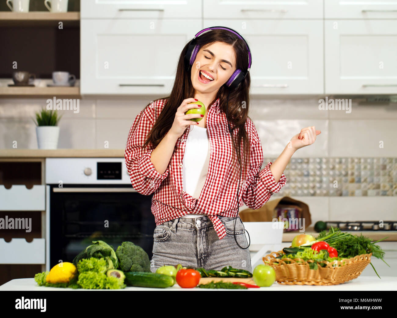 Girl Singing as Cooking Stock Photo - Alamy
