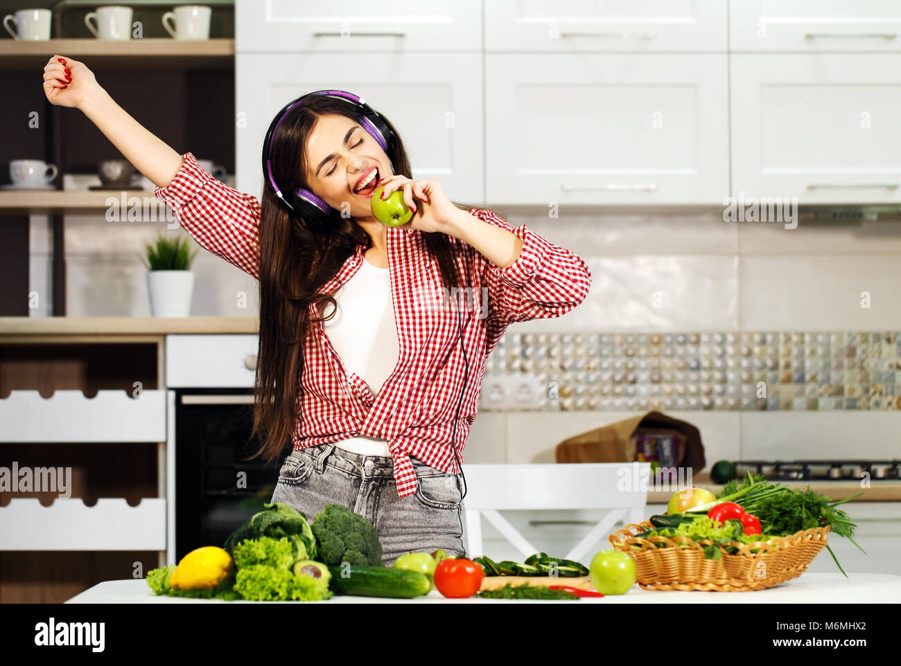 Girl Singing as Cooking Stock Photo - Alamy