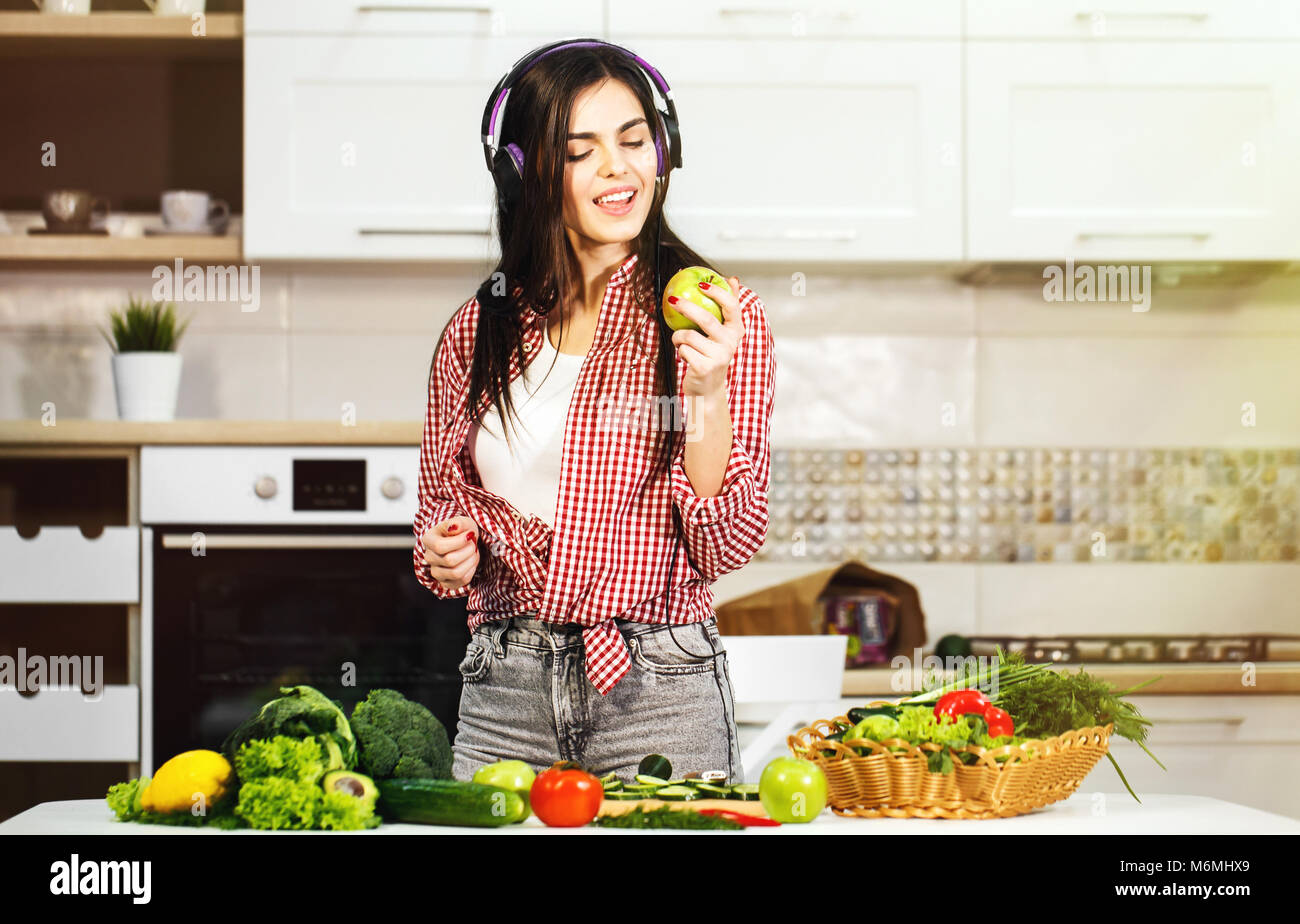 Girl Singing as Cooking Stock Photo - Alamy