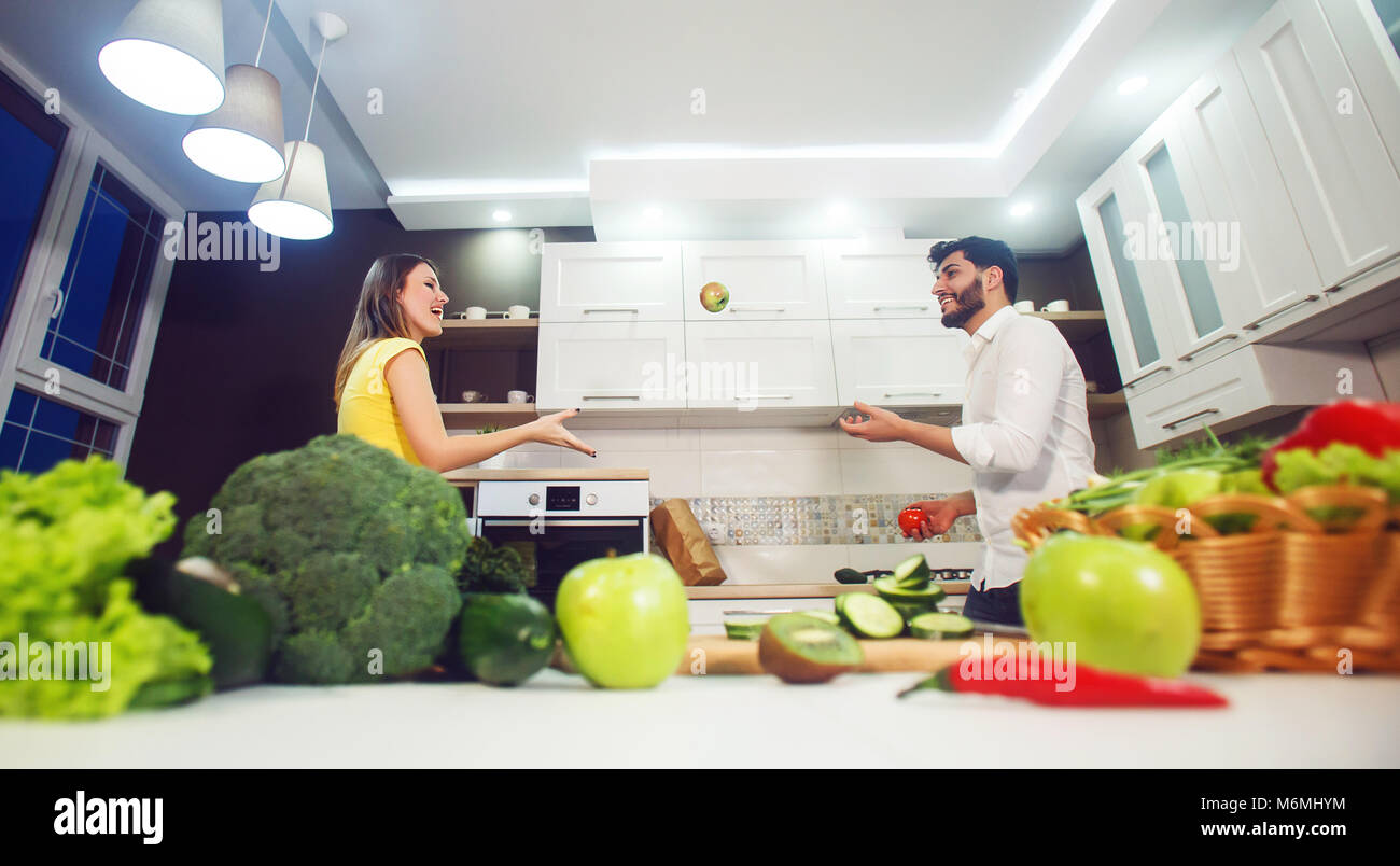 Couple Having Fun in Kitchen Stock Photo - Alamy