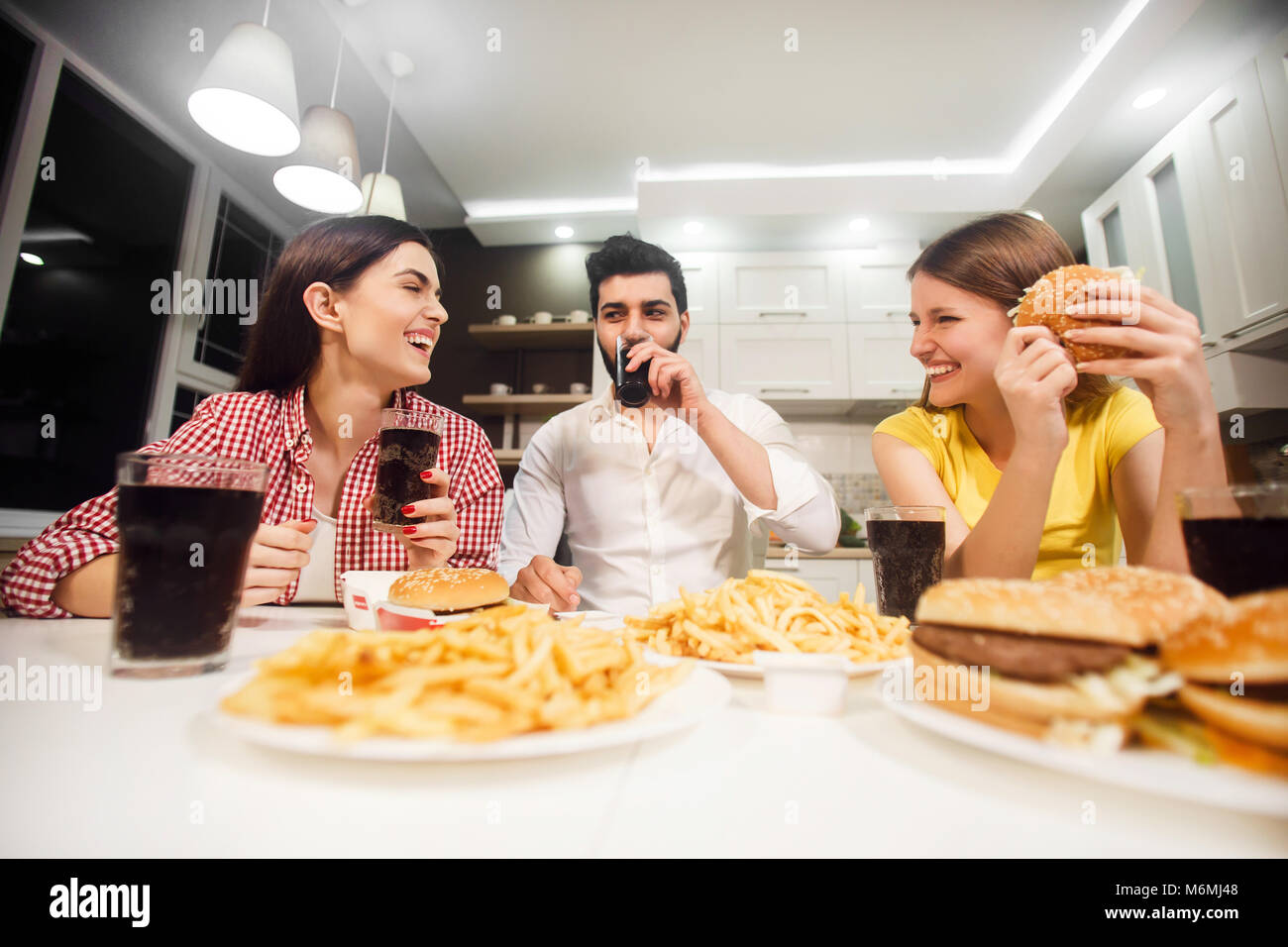 Guys Having Talk at Dinner Stock Photo - Alamy