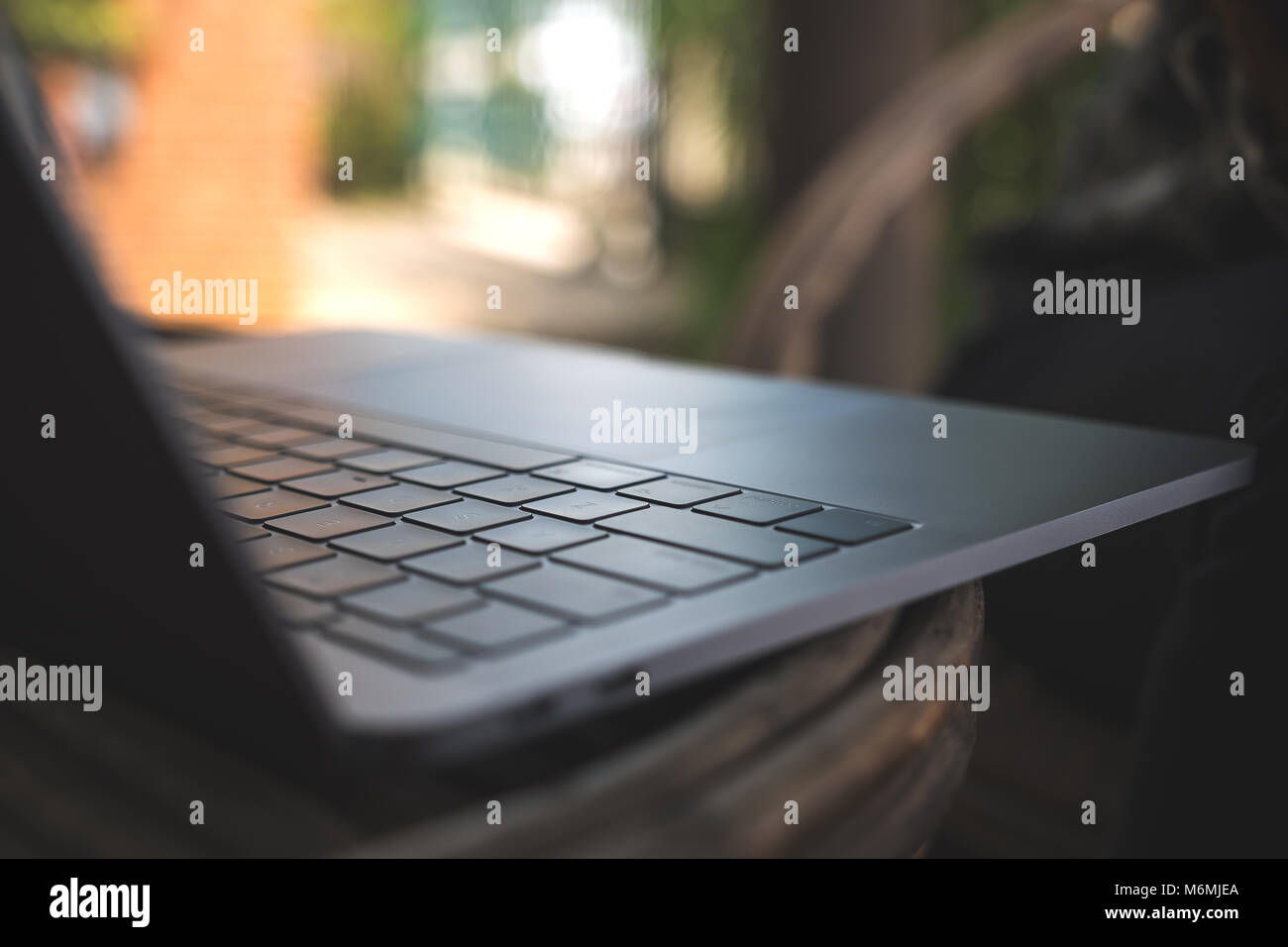 Closeup image of a laptop keyboard with blur background Stock Photo - Alamy