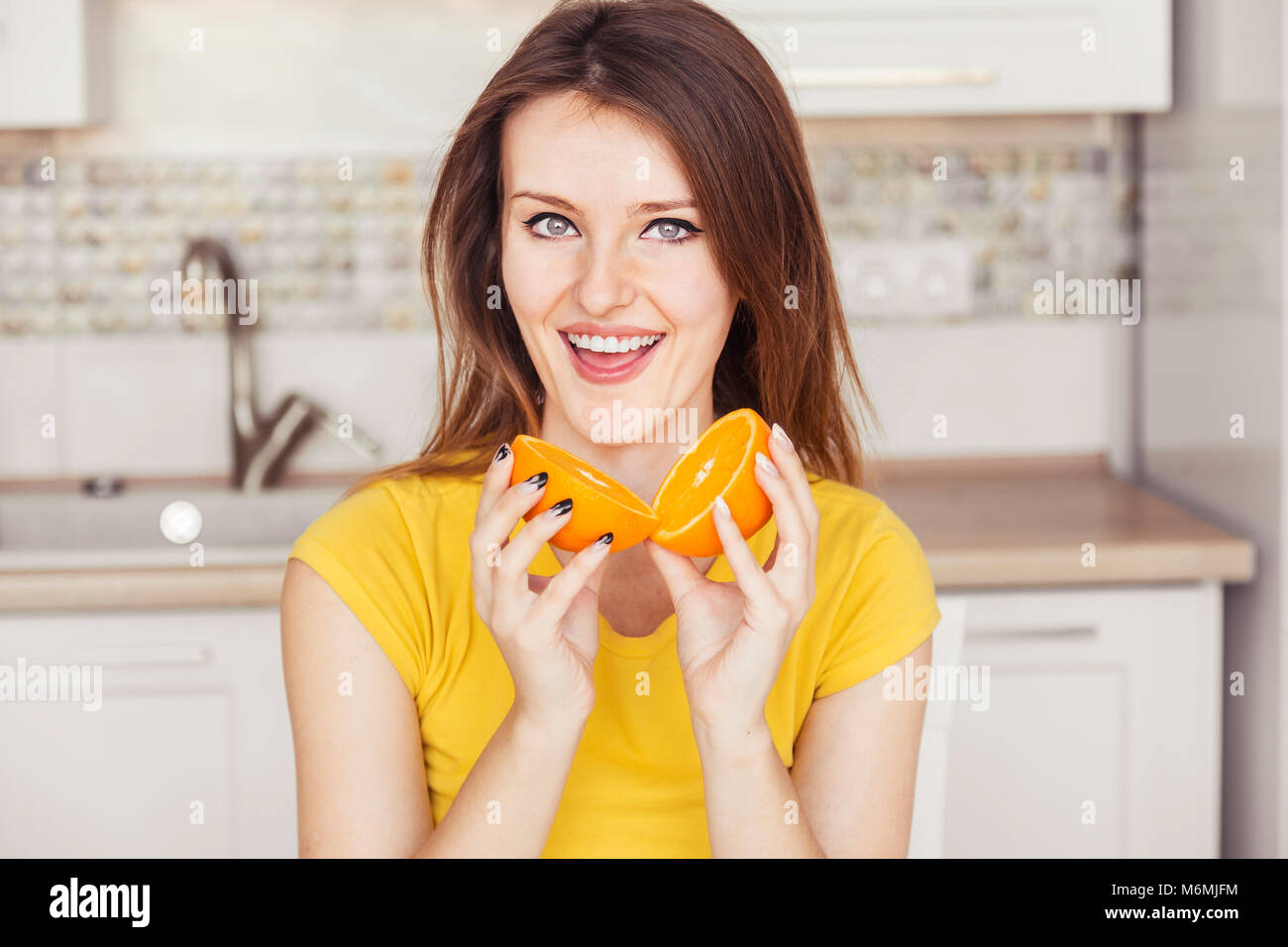 Beautiful Girl with Orange Stock Photo - Alamy