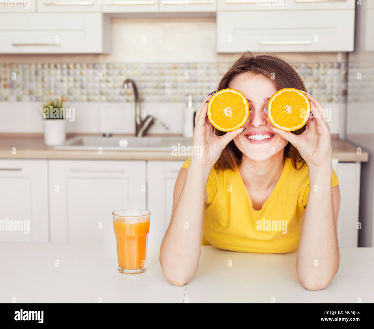 Beautiful Girl with Orange Stock Photo - Alamy