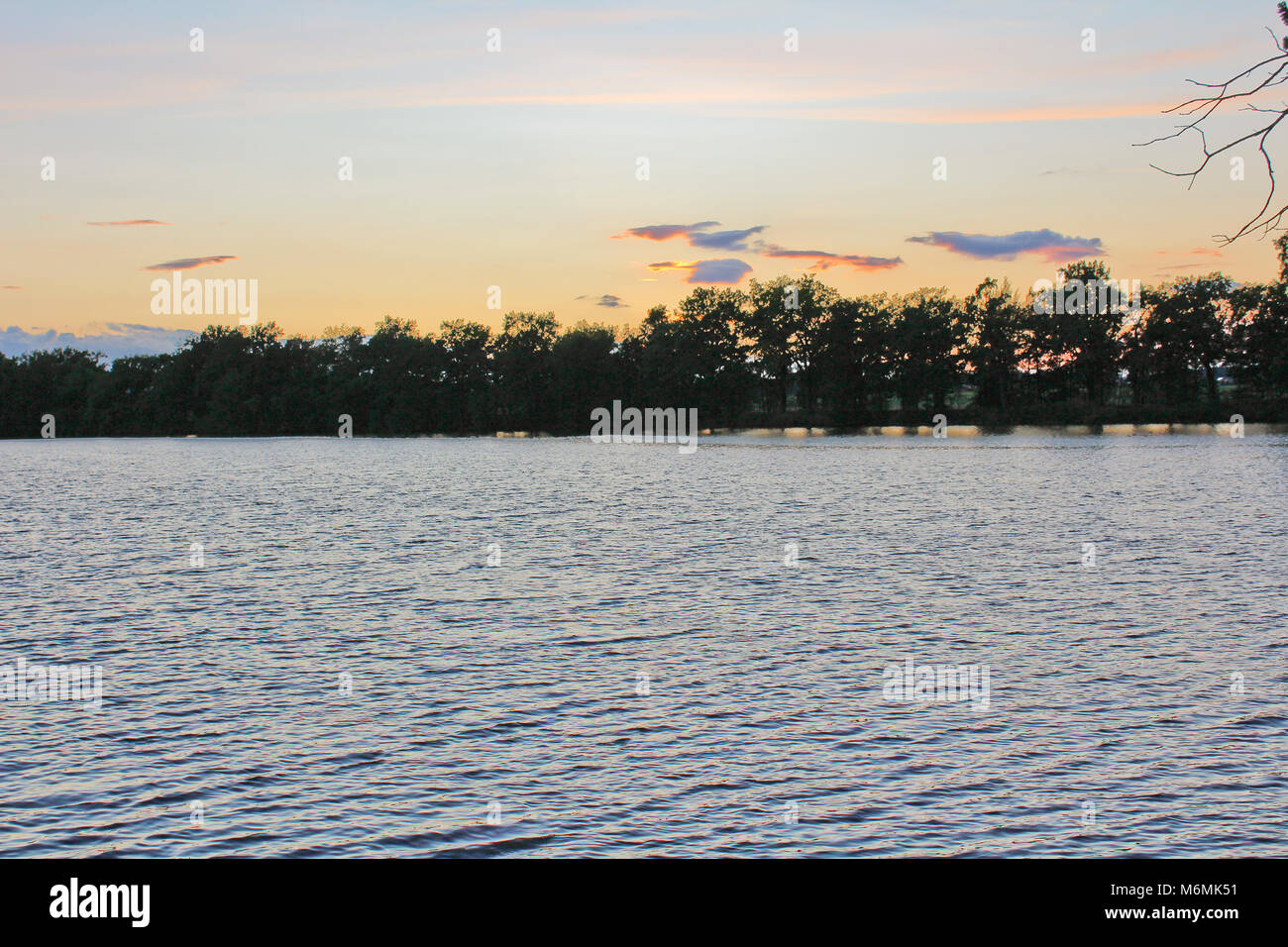 Sunset on pond with trees silhouette, Czech landscape Stock Photo - Alamy
