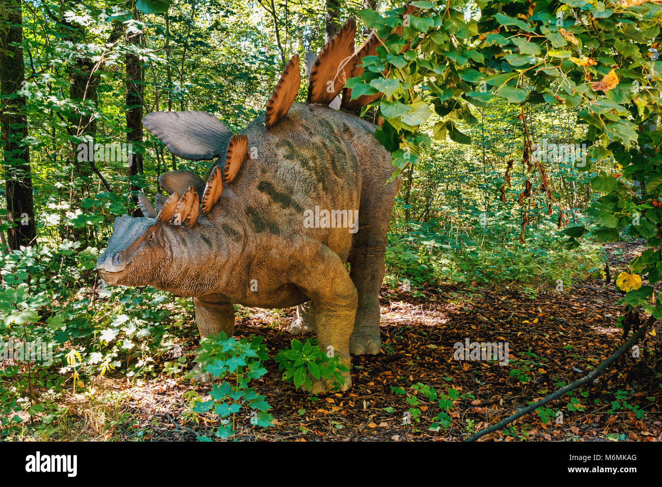 Big model of prehistoric dinosaur stegosaurus in nature. Realistic ...