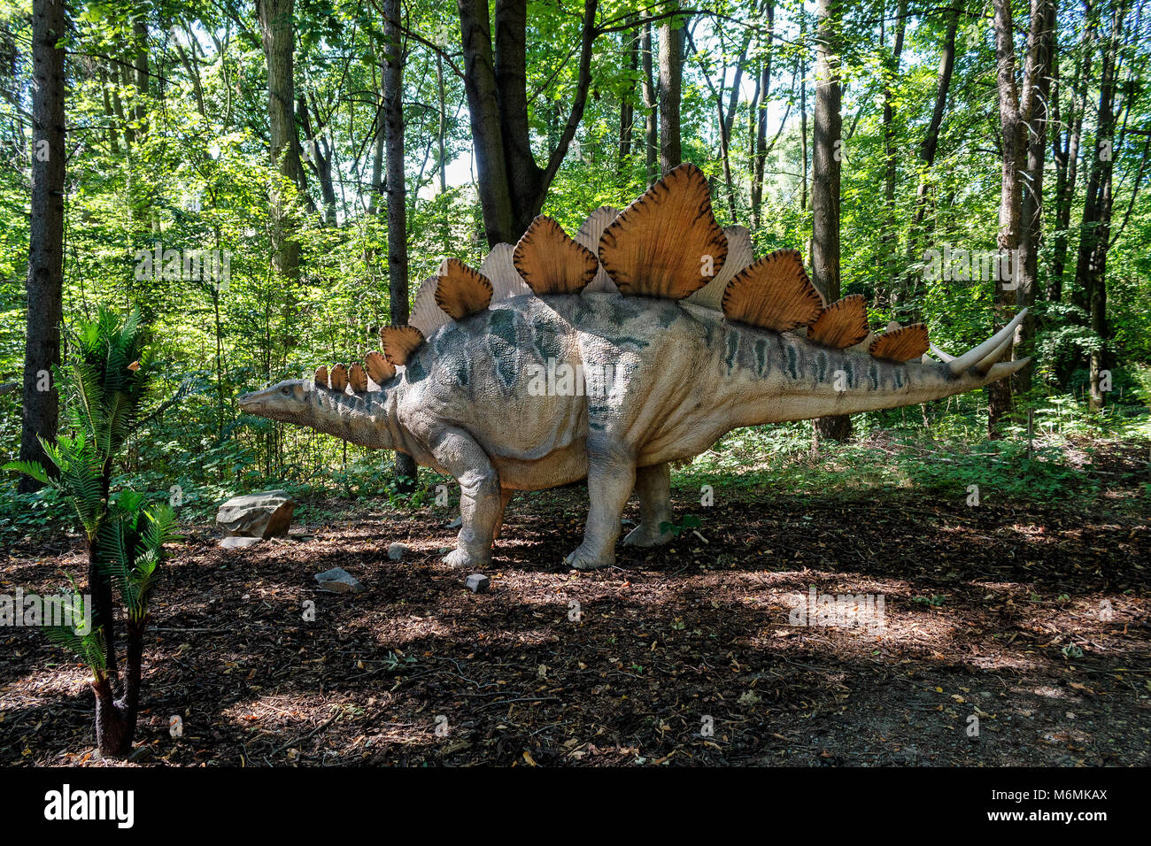 Big model of prehistoric dinosaur stegosaurus in nature. Realistic ...