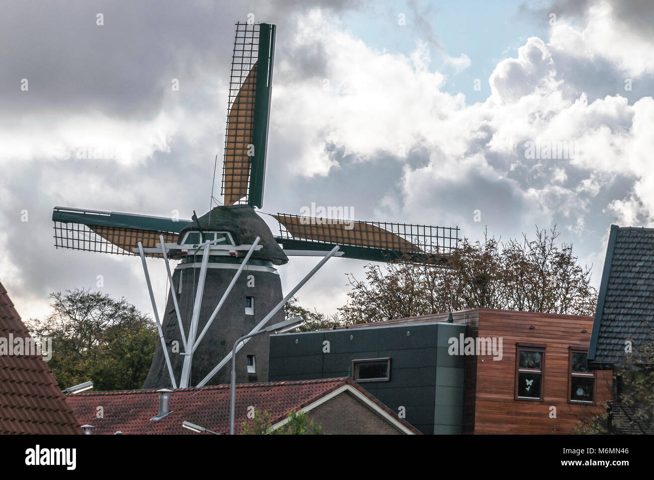 windmill standing near a village Stock Photo - Alamy