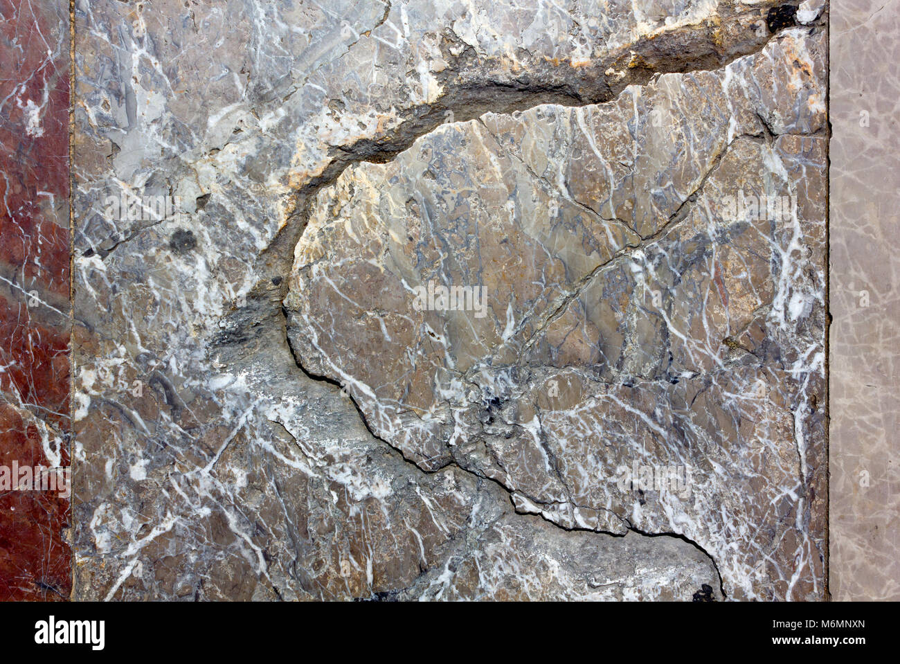 Close-up on a marble floor composed by tiles of three different kinds ...