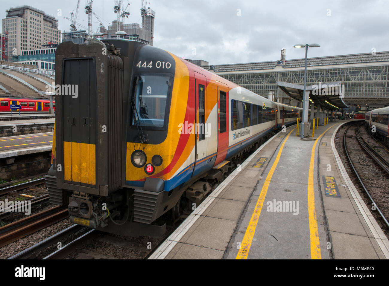 a train in a platfrom at the mainline railway station of london ...