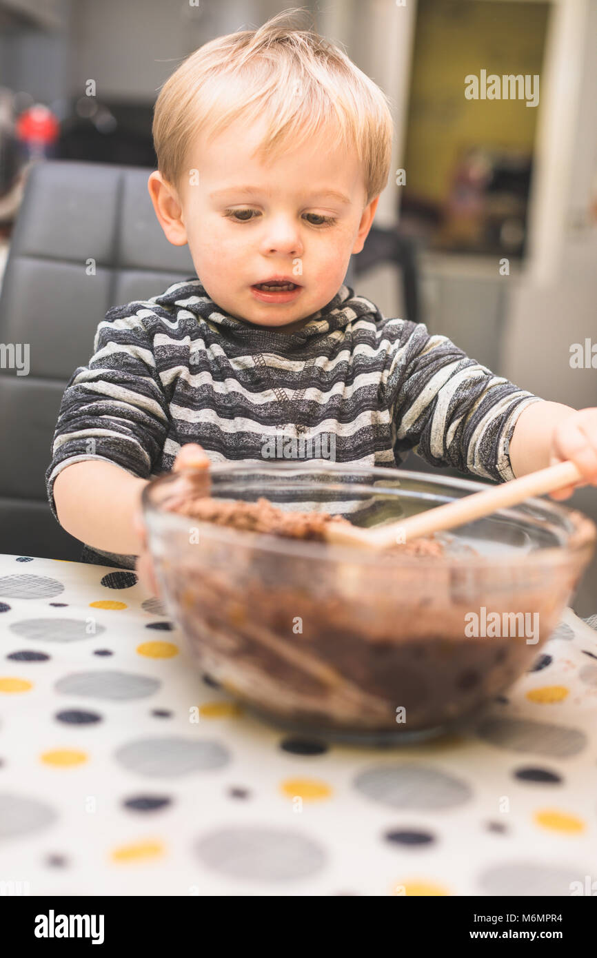Boy baking chocolate brownies and making a mess Stock Photo - Alamy