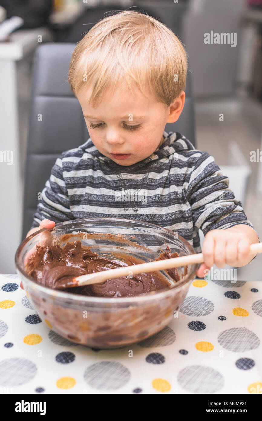 Boy baking chocolate brownies and making a mess Stock Photo - Alamy
