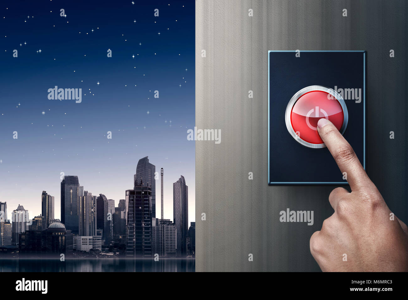 Hand turning off switch on the wall with city at night background Stock ...