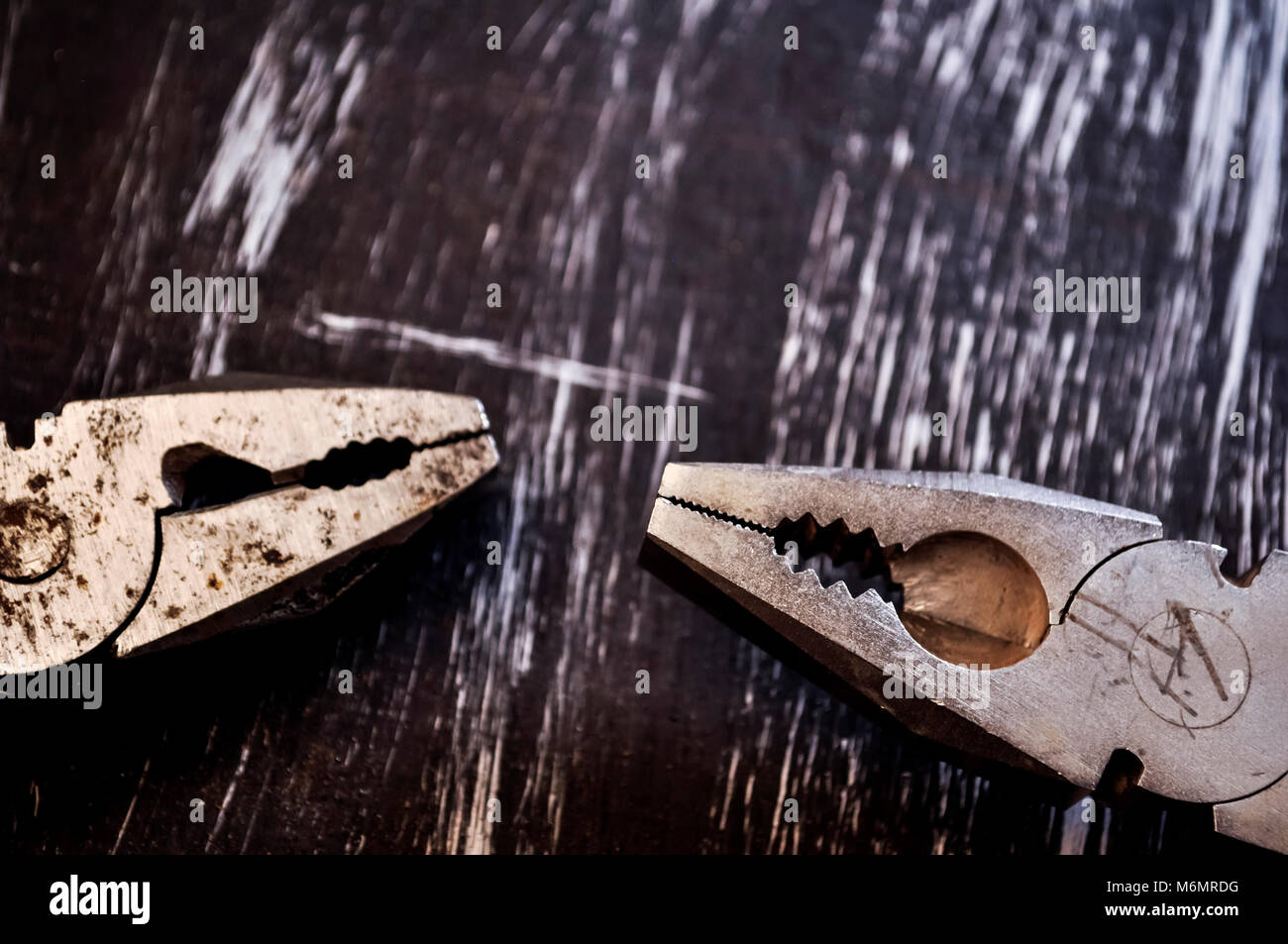 Pliers for repair work lying on the table. Repair tools in the h Stock ...